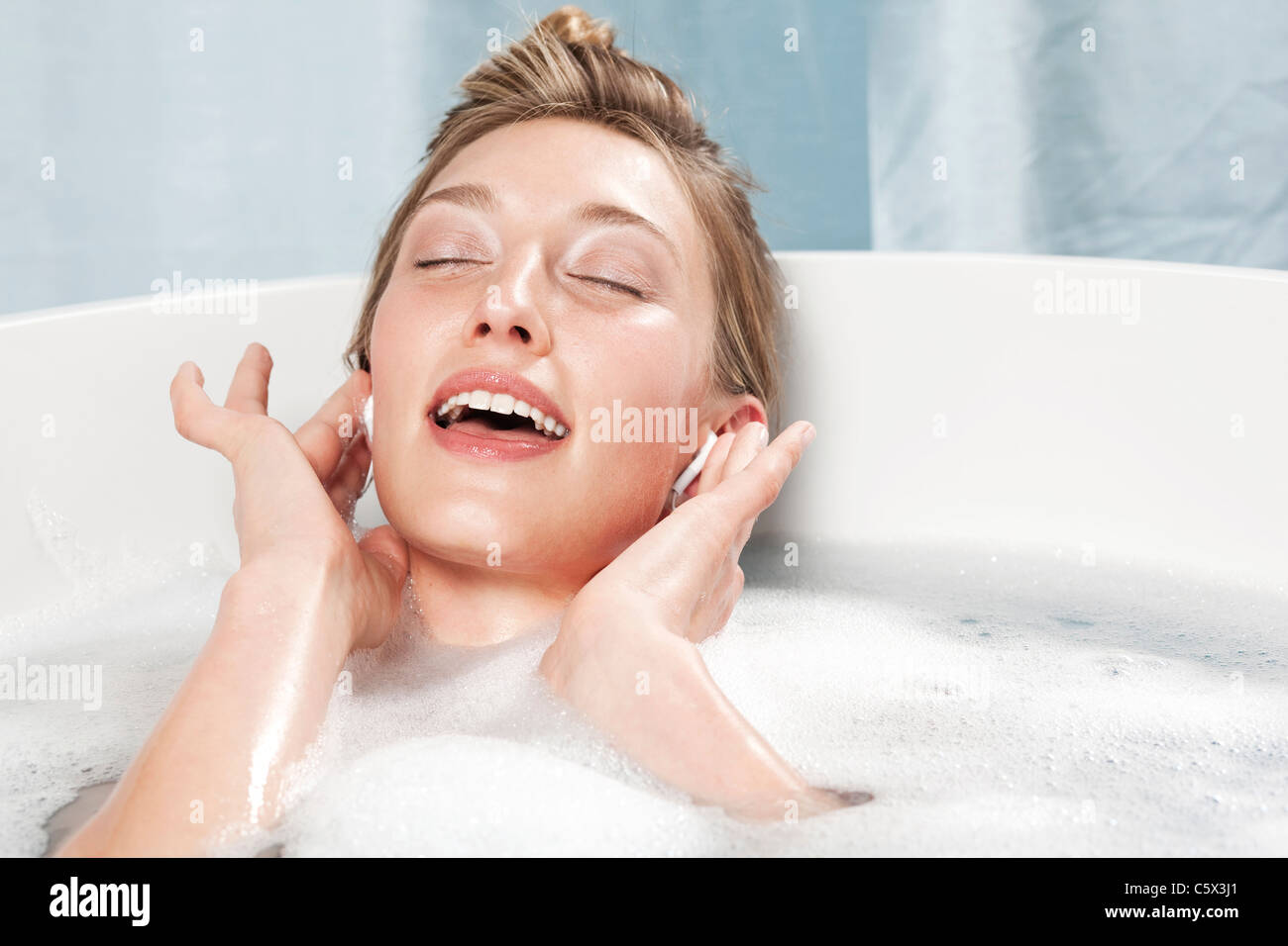 Listening to music in bath tub hi-res stock photography and images - Alamy