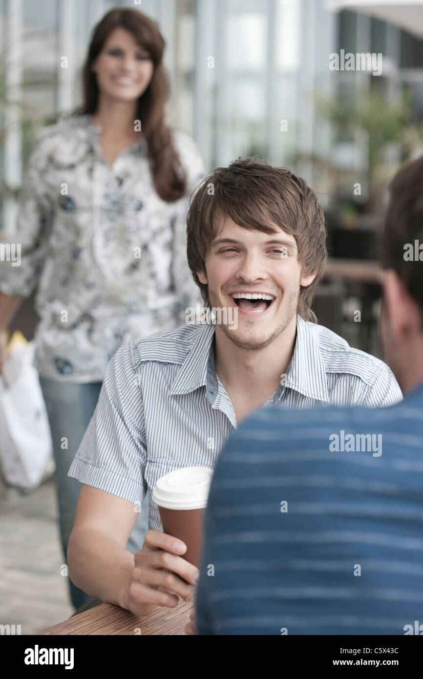 Germany, Cologne, People sitting in cafe Stock Photo - Alamy