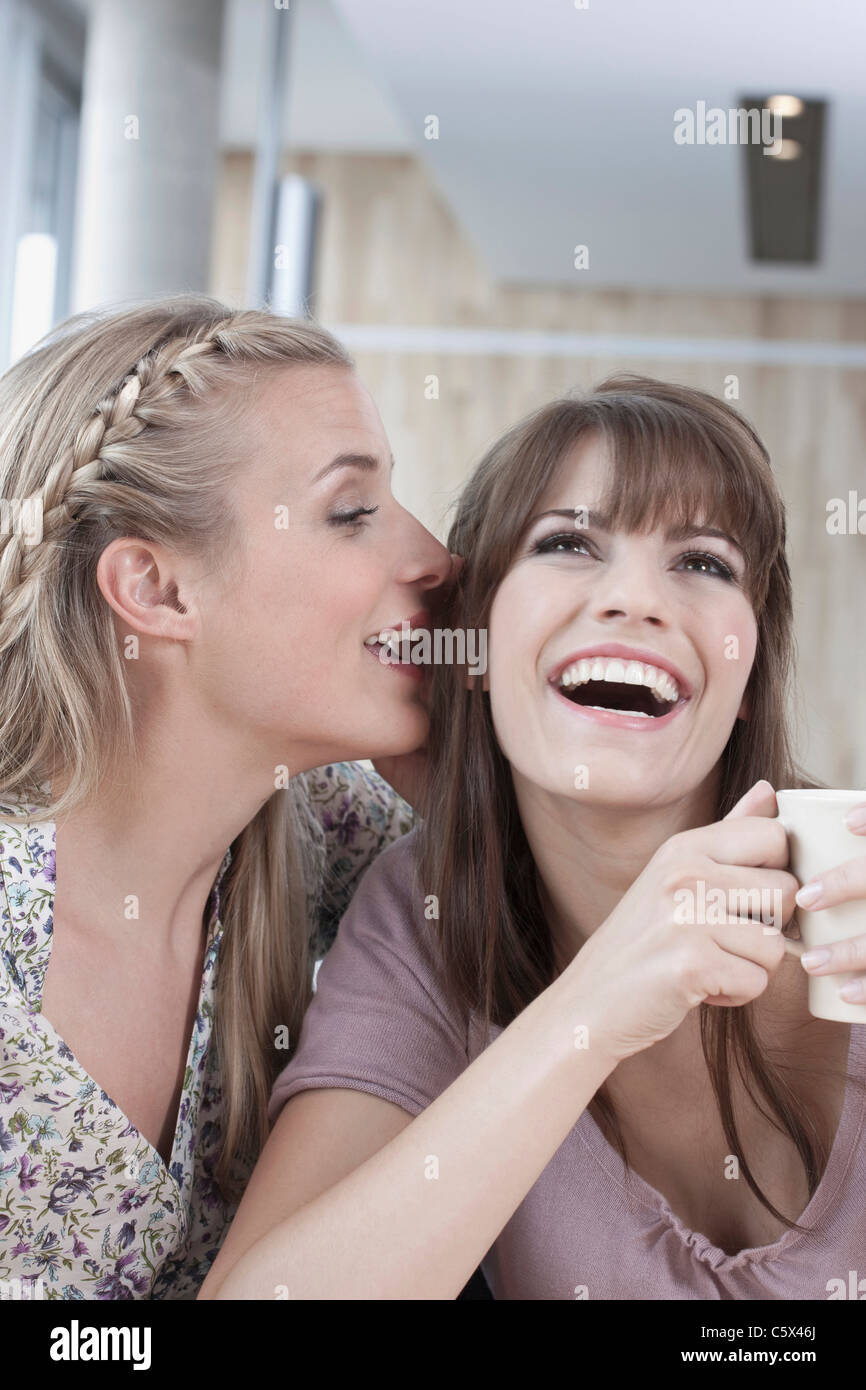 Germany, Cologne, Young women in cafe, having fun Stock Photo - Alamy