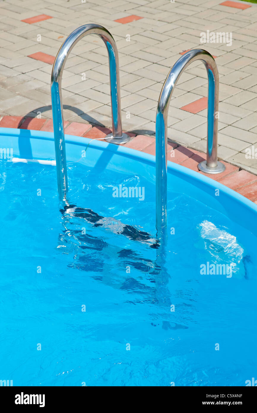 Metal swimming pool steps Stock Photo - Alamy