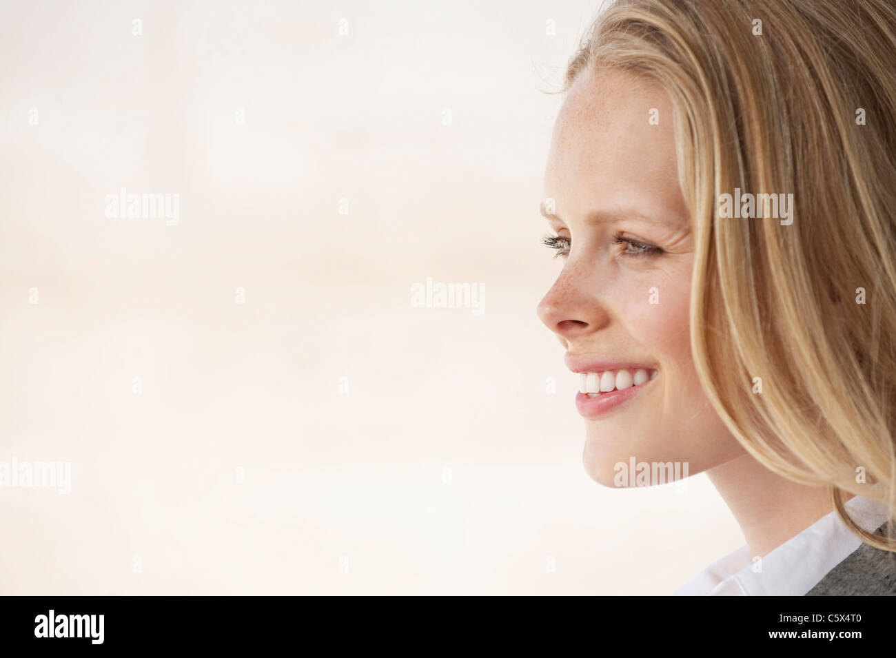Young businesswoman laughing, side view, portrait Stock Photo - Alamy
