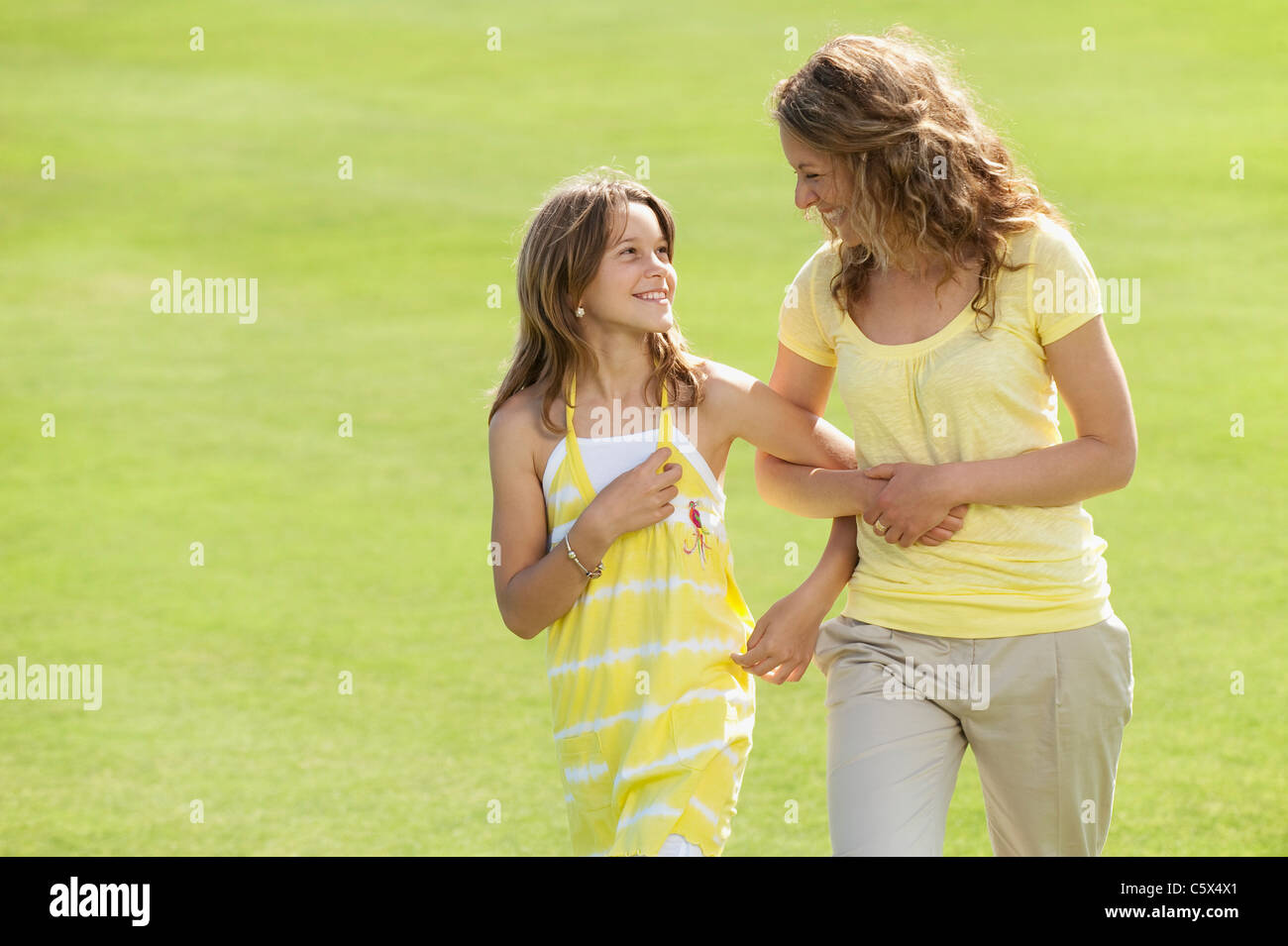 Girl walking across field hi-res stock photography and images - Alamy
