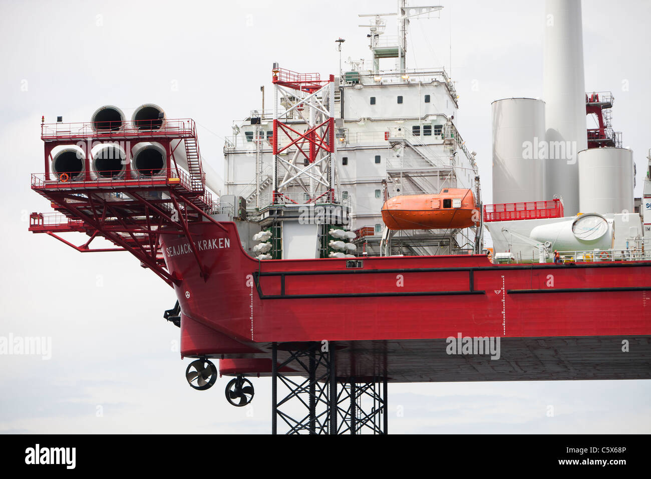 A jack up barge fitting wind turbines in the Walney Offshore windfarm ...