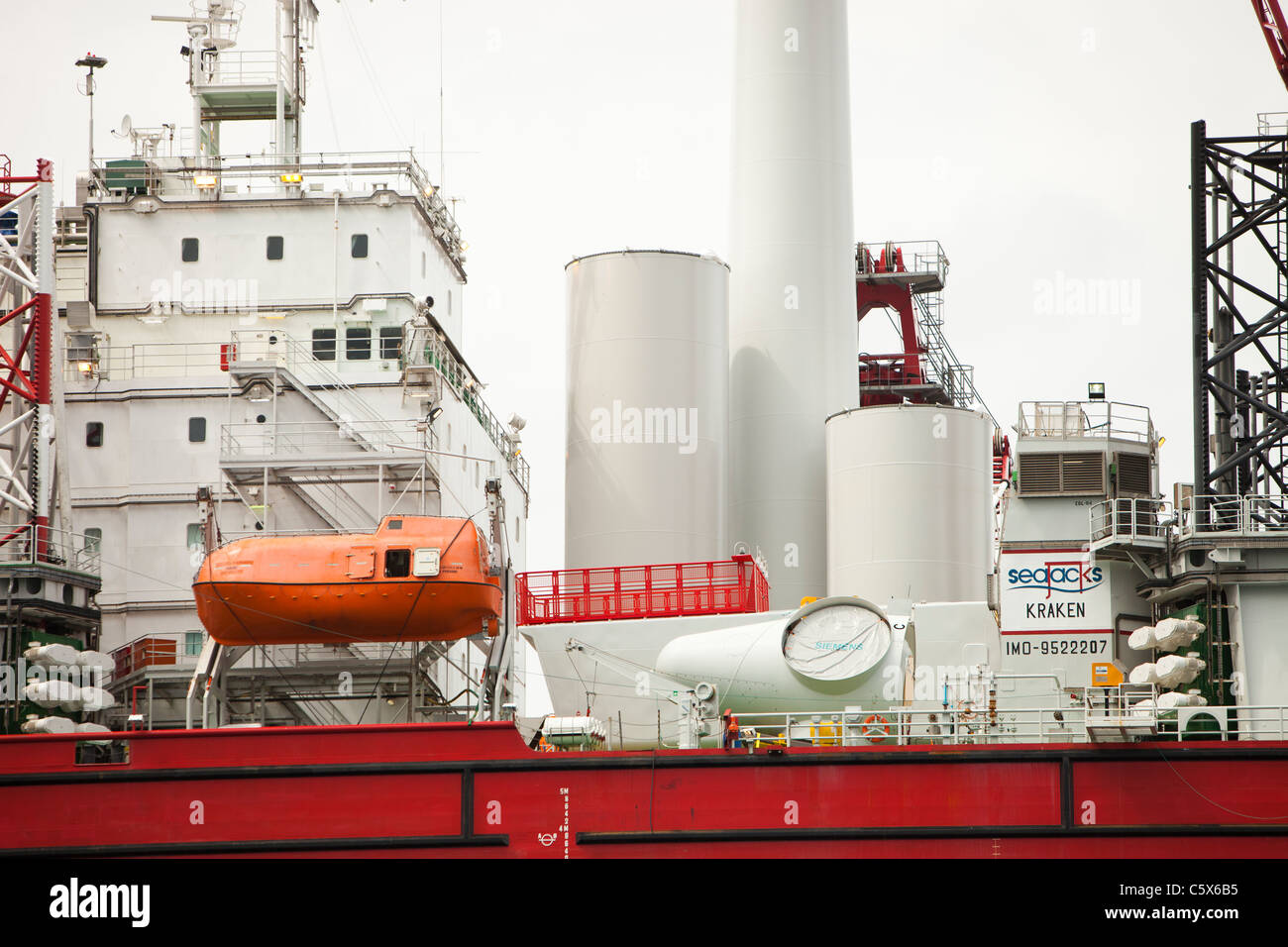 A jack up barge fitting wind turbines in the Walney Offshore windfarm ...