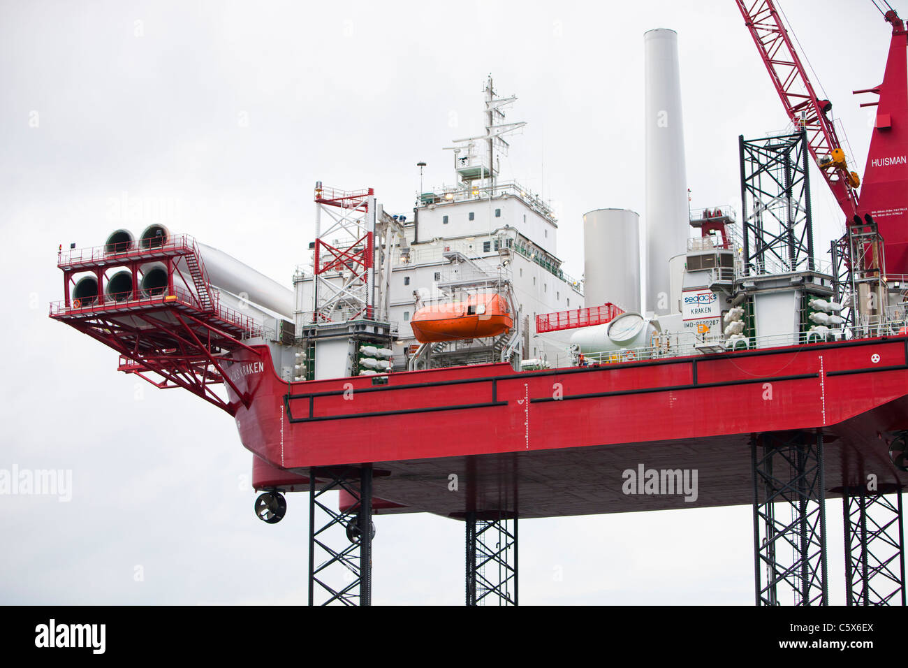 A jack up barge fitting wind turbines in the Walney Offshore windfarm ...