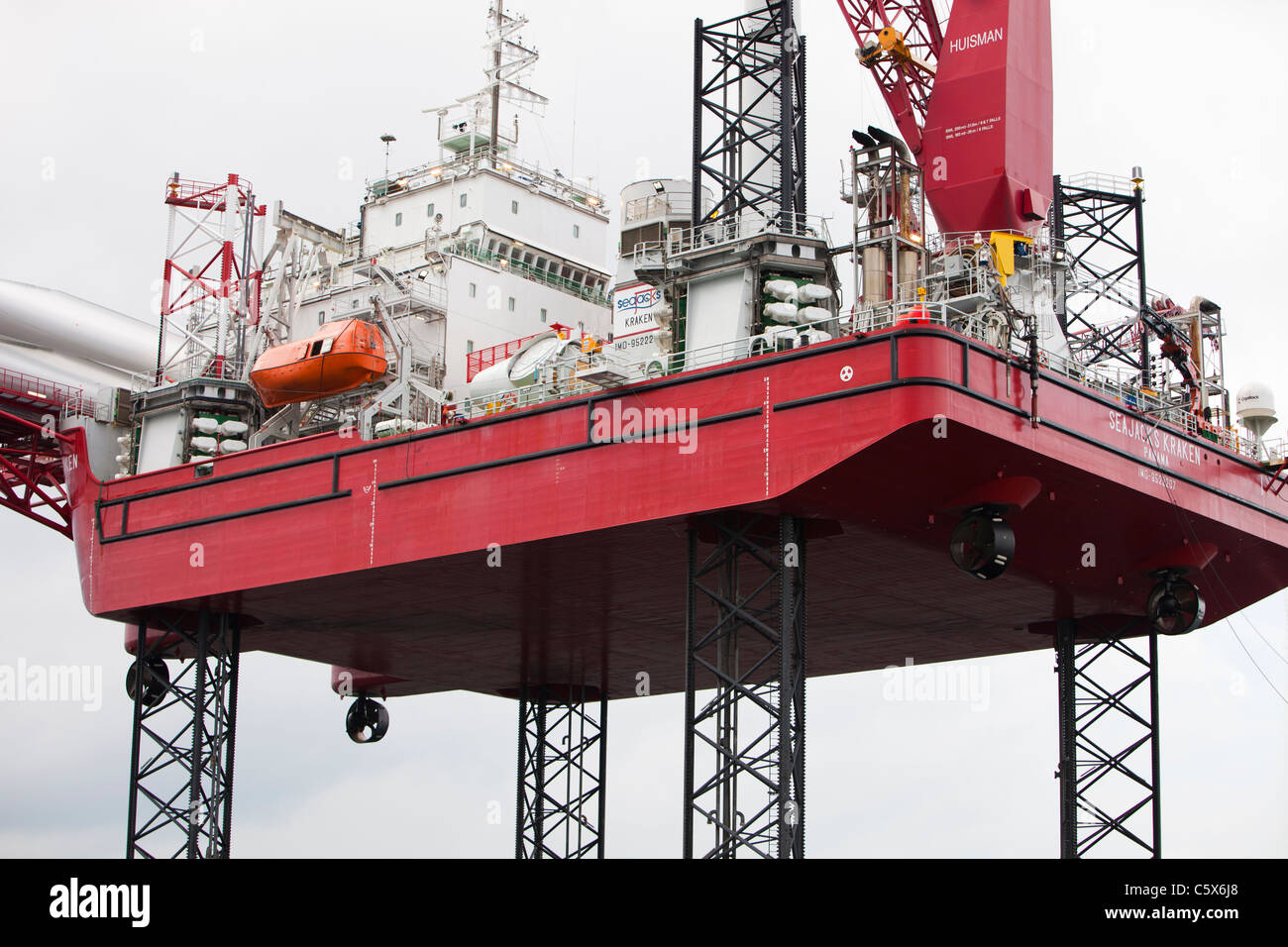 A jack up barge fitting wind turbines in the Walney Offshore windfarm ...