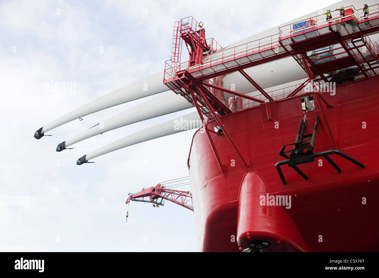 A jack up barge fitting wind turbines in the Walney Offshore windfarm ...