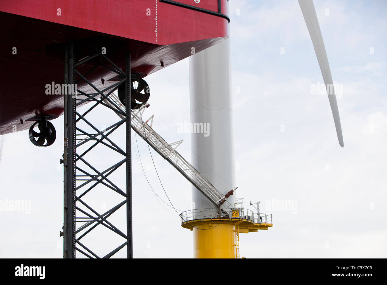 A jack up barge fitting wind turbines in the Walney Offshore windfarm ...