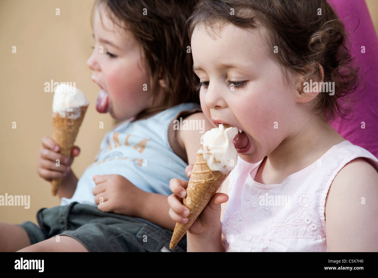 Side view two girls licking hi-res stock photography and images - Alamy