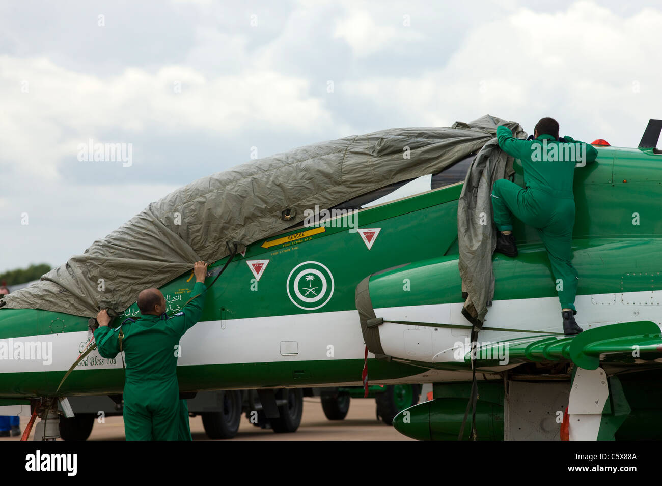 Saudi Hawks aerobatic display team, ground crew covering the aircraft ...