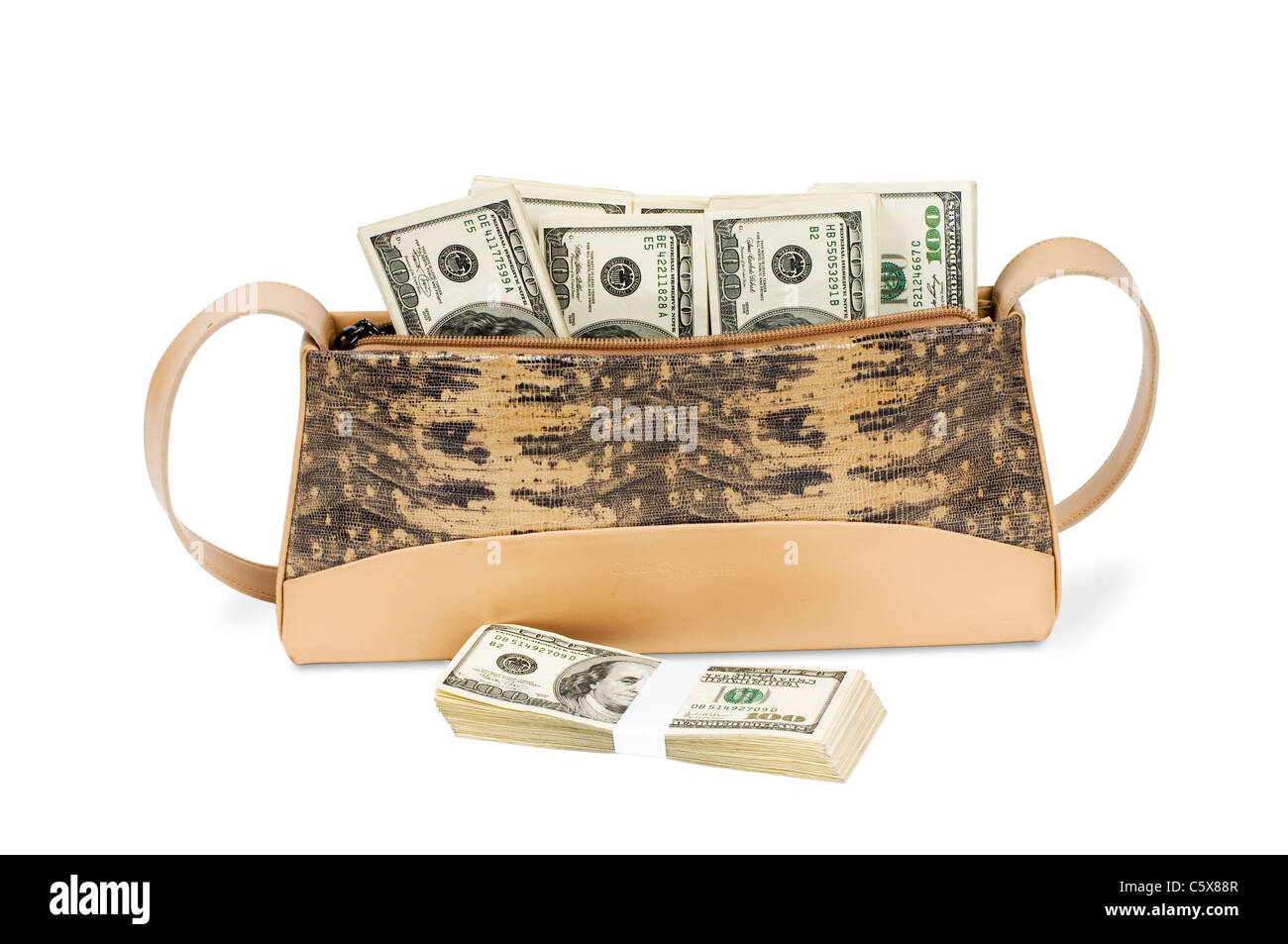 Female handbag with packings of dollars Stock Photo - Alamy