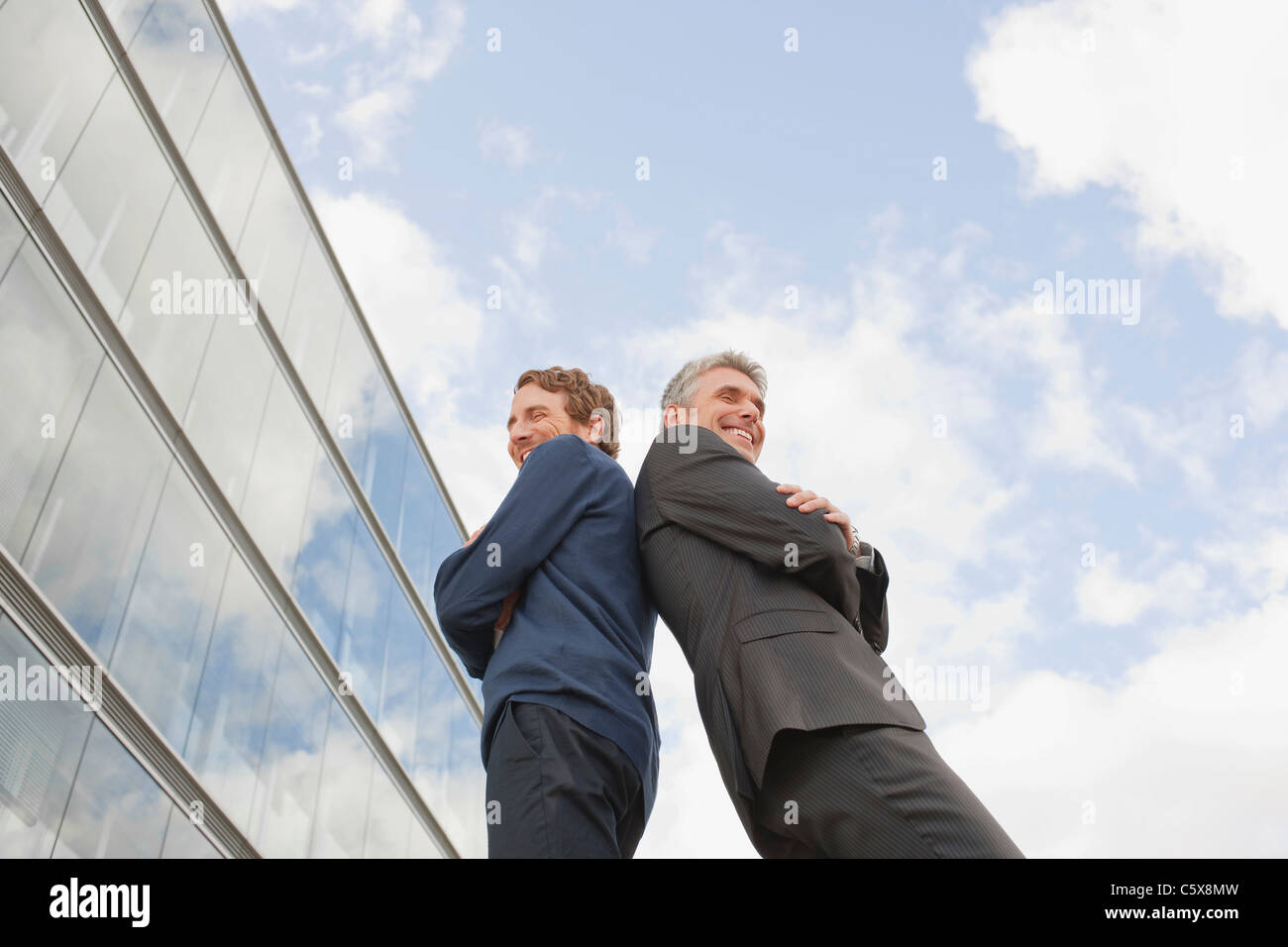 Two people standing back to back hi-res stock photography and images ...