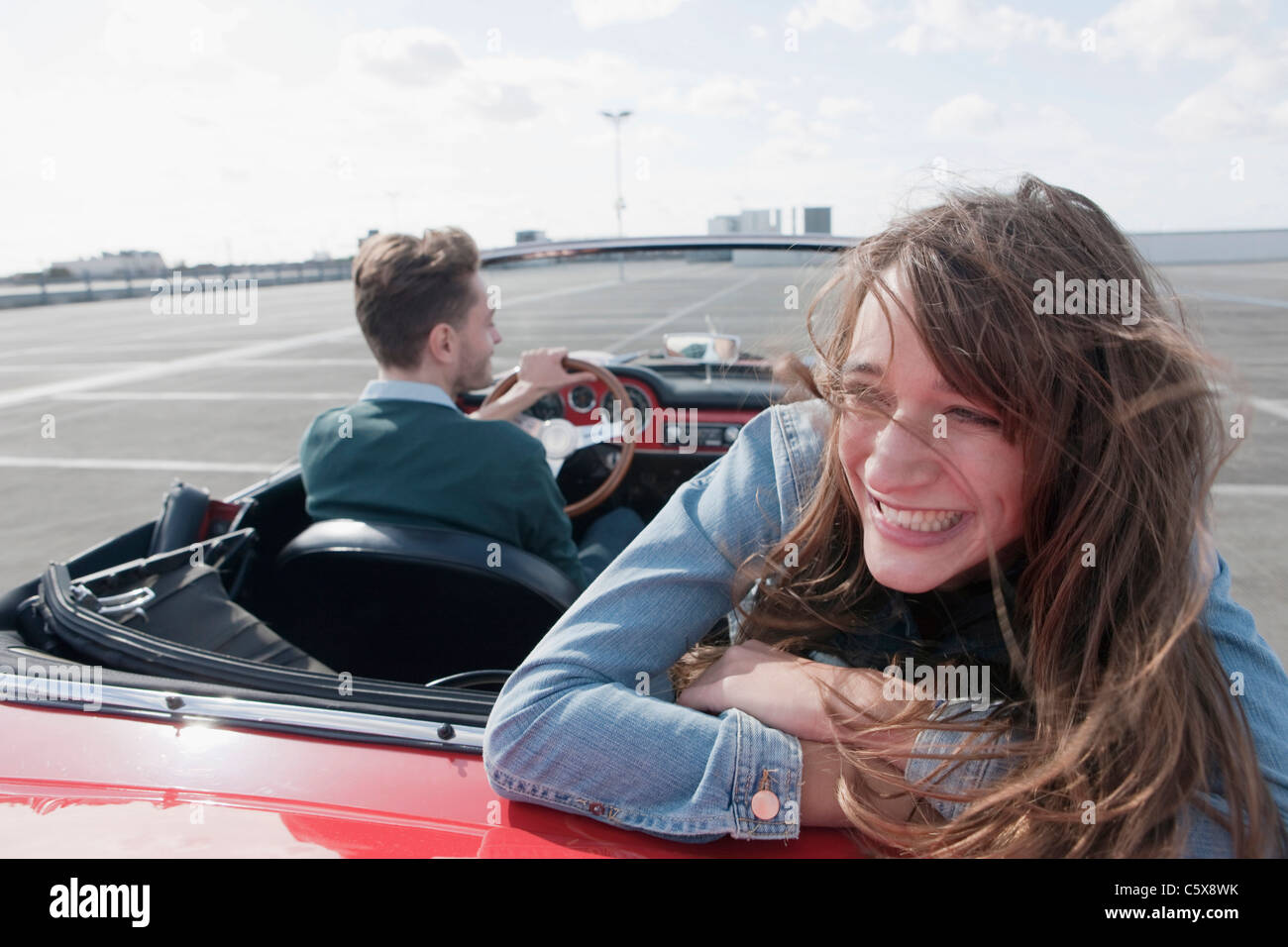 Germany, Berlin, Couple driving in cabriolet, smiling, portrait Stock ...