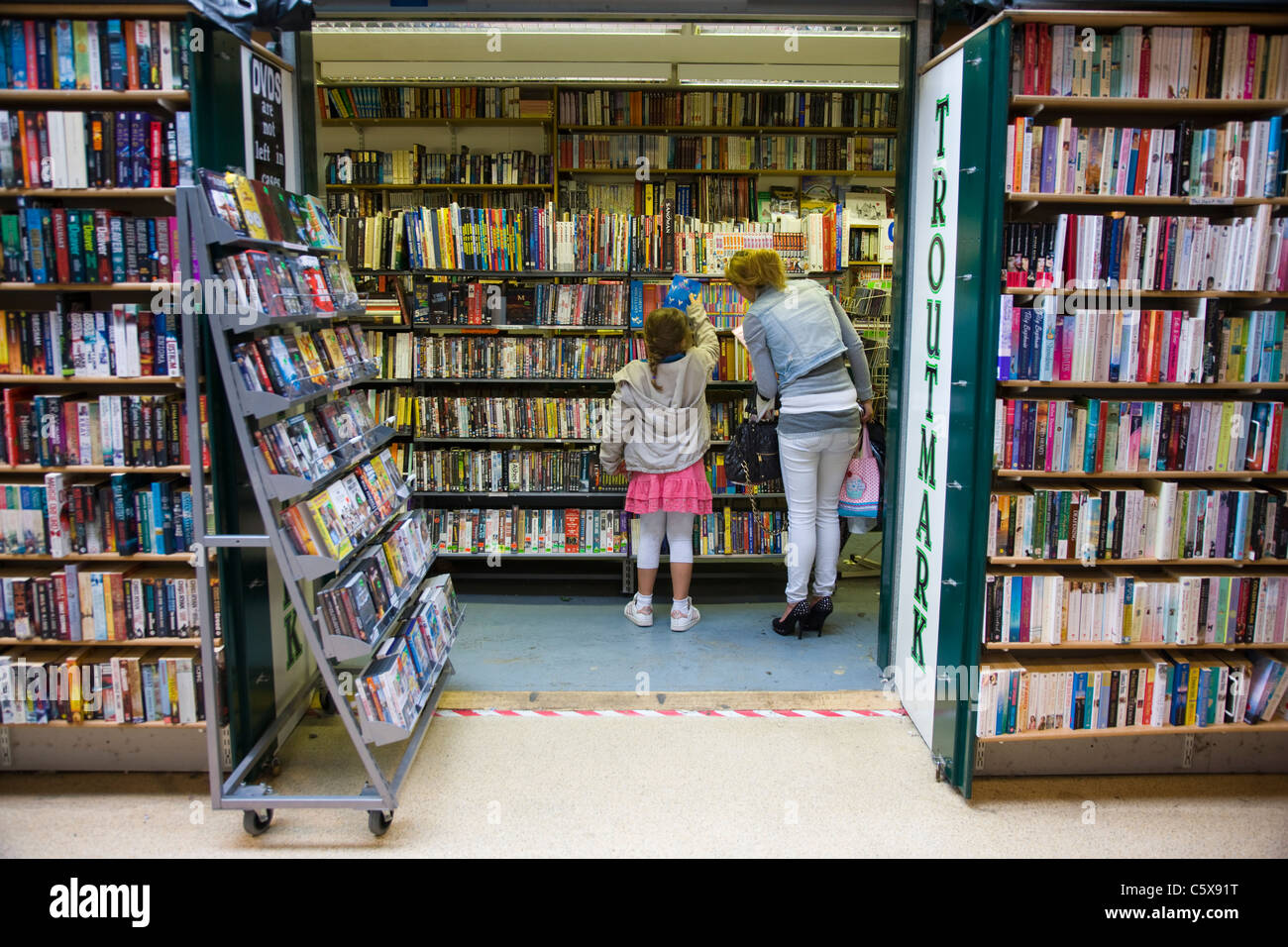 Browsing the shelves of a market bookshop in Newport, South Wales Stock ...