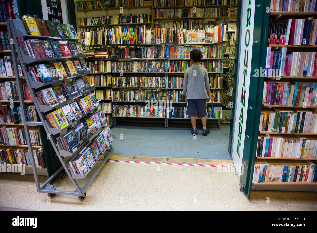 Browsing the shelves of a market bookshop in Newport, South Wales Stock ...