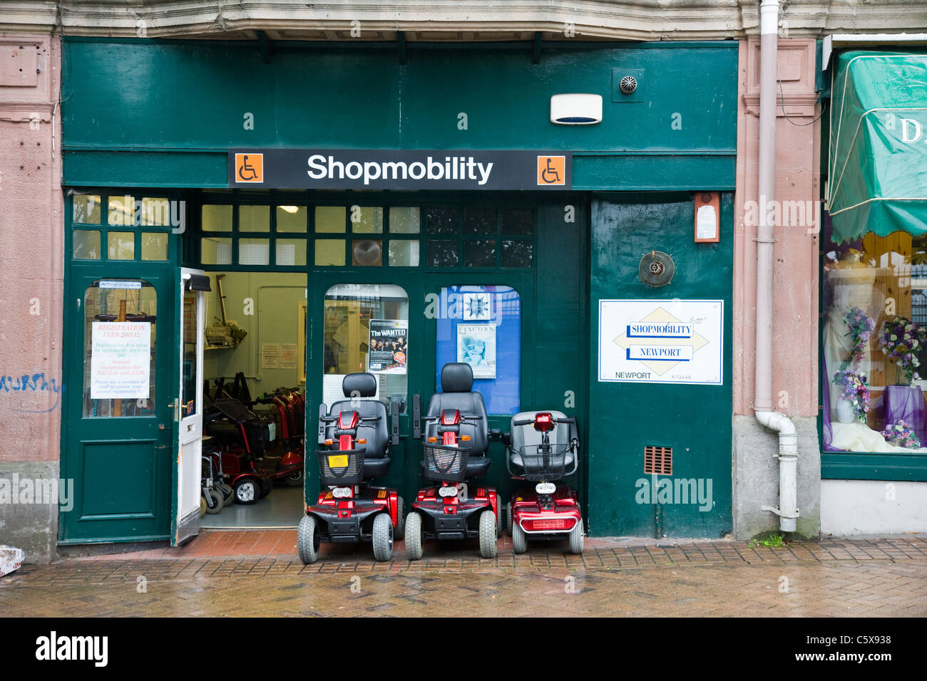Shopmobility scooters and invalid carriages parked outside the ...