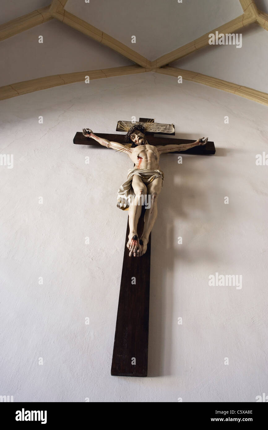 Crucifix on wall, low angle view Stock Photo - Alamy