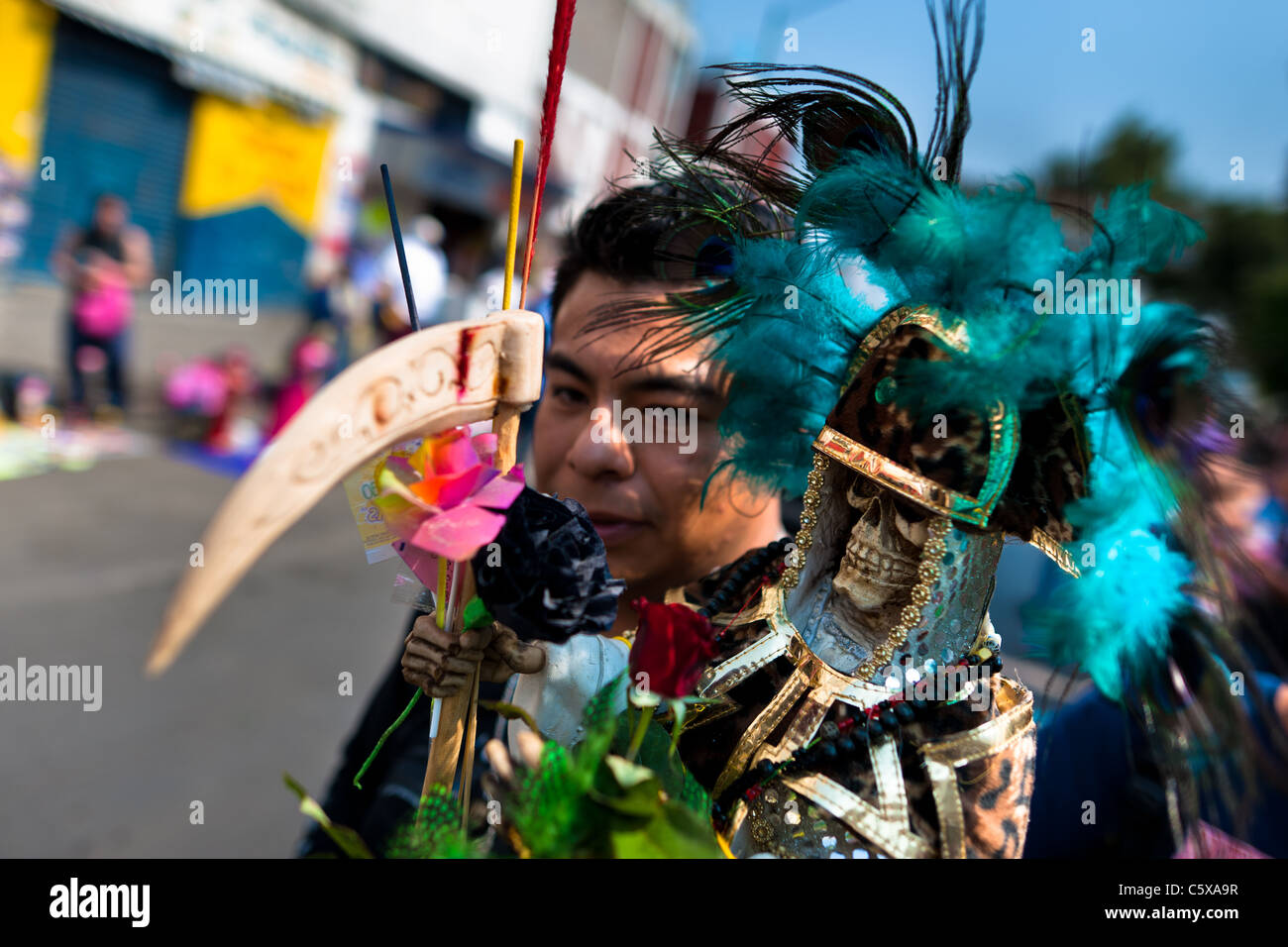 A Mexican believer to Santa Muerte (Saint Death) holds a sacred ...