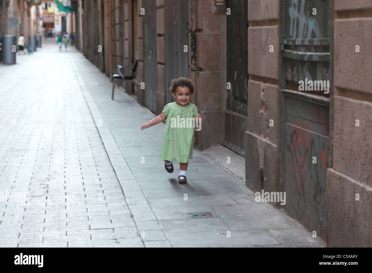 Girl Running and Laughing Stock Photo - Alamy