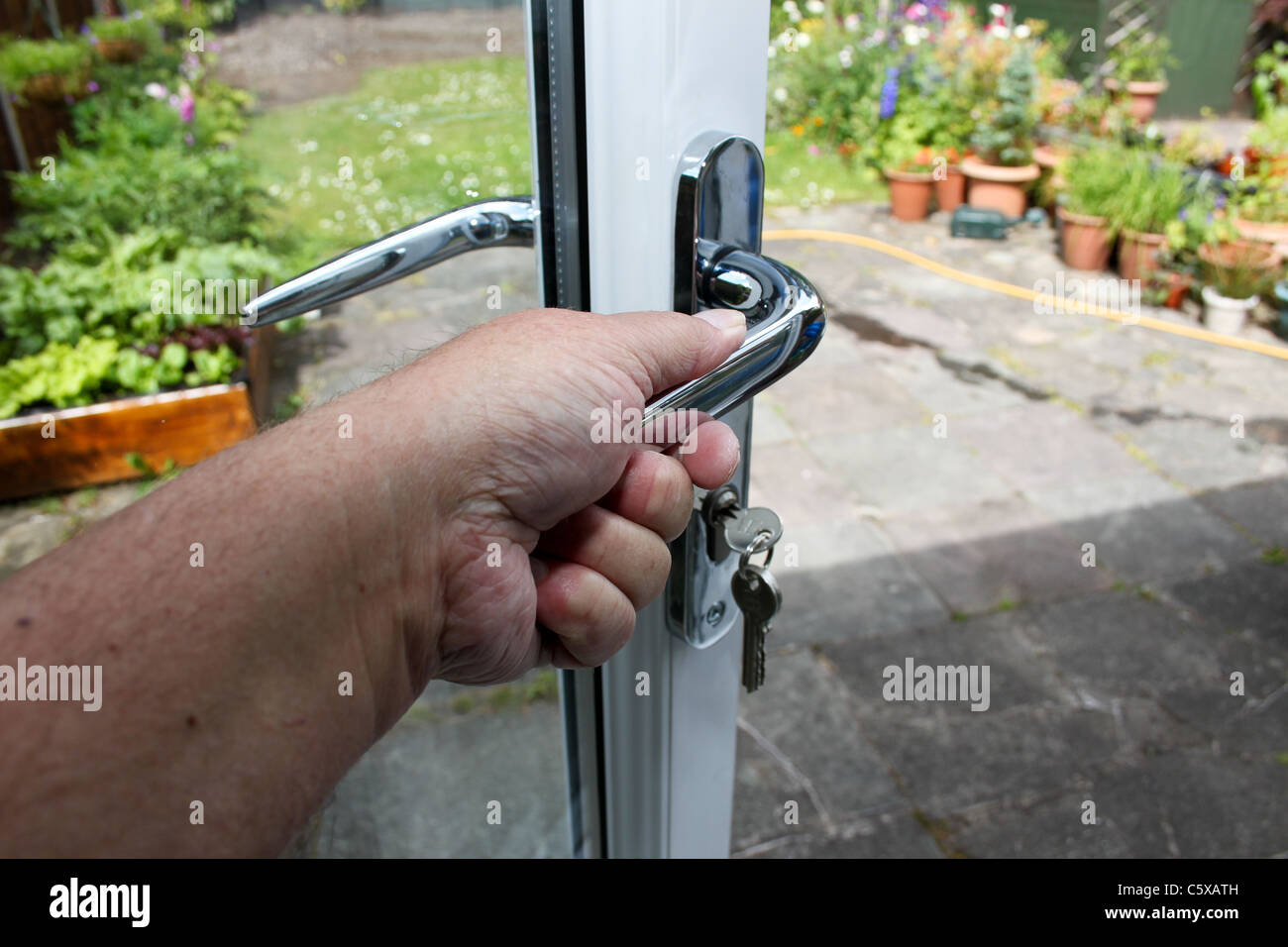 close up of a hand opening a window Stock Photo - Alamy