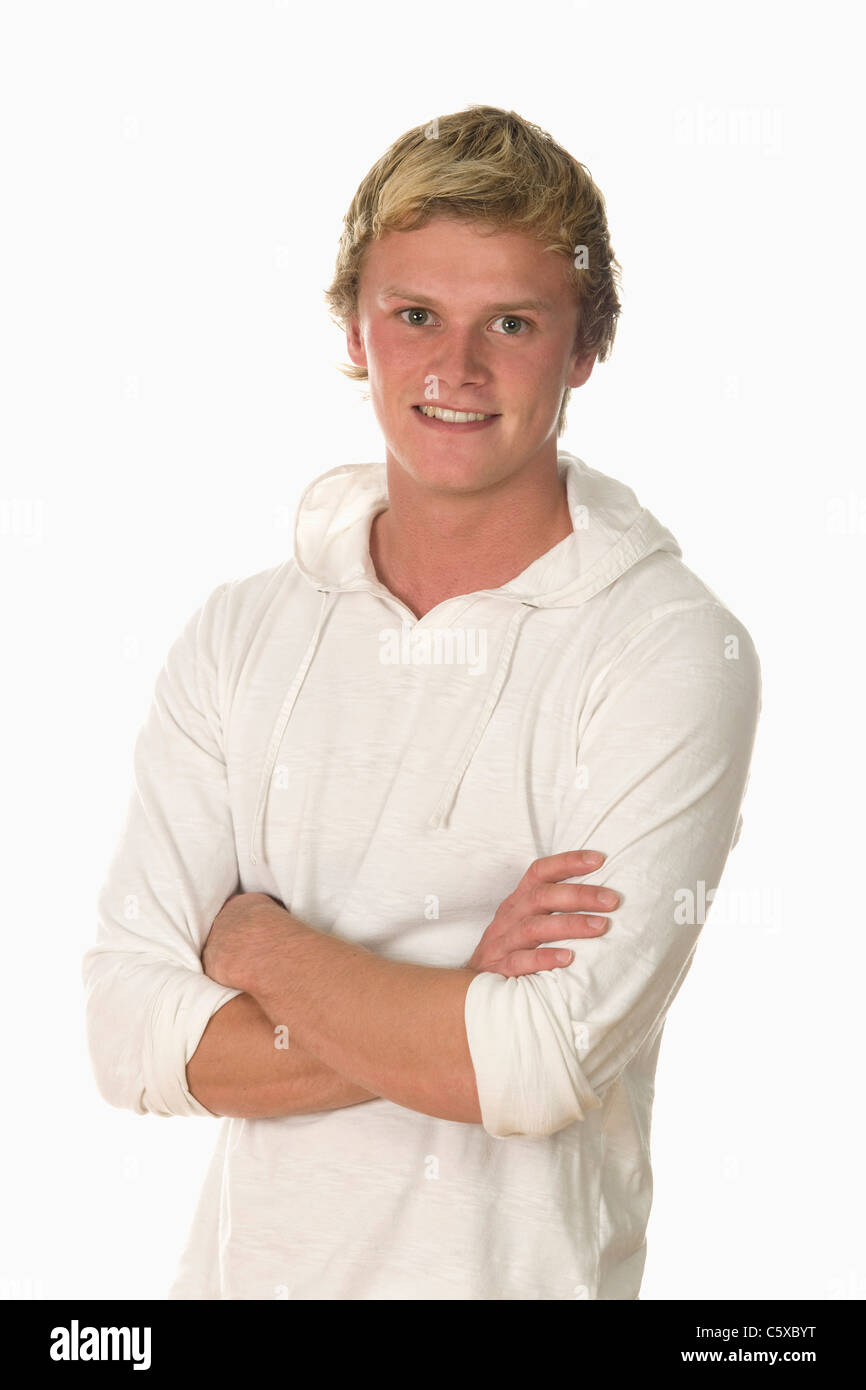 Young man, arms crossed, smiling, portrait Stock Photo - Alamy
