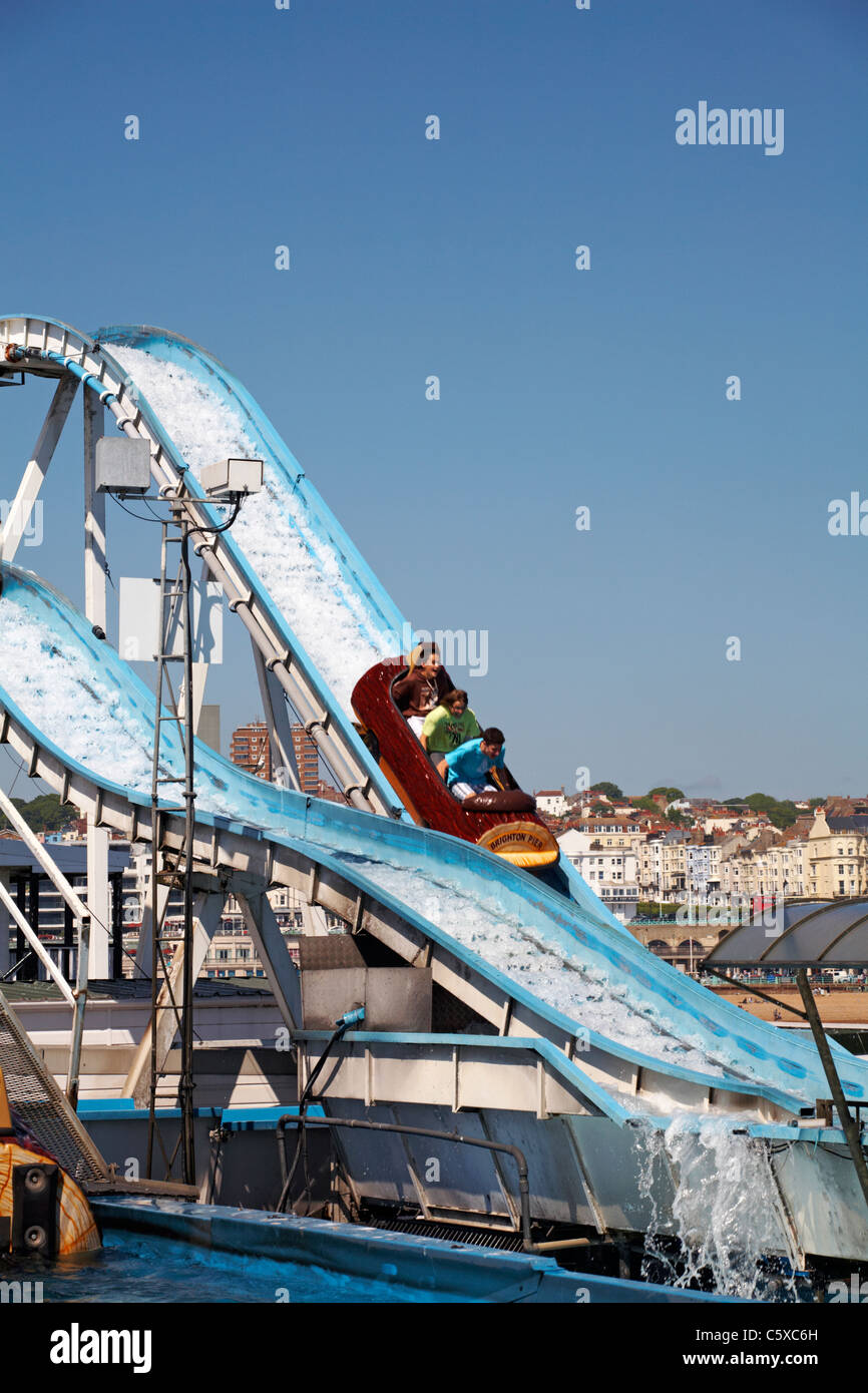 Having fun on the log ride on Brighton Pier in May Stock Photo - Alamy