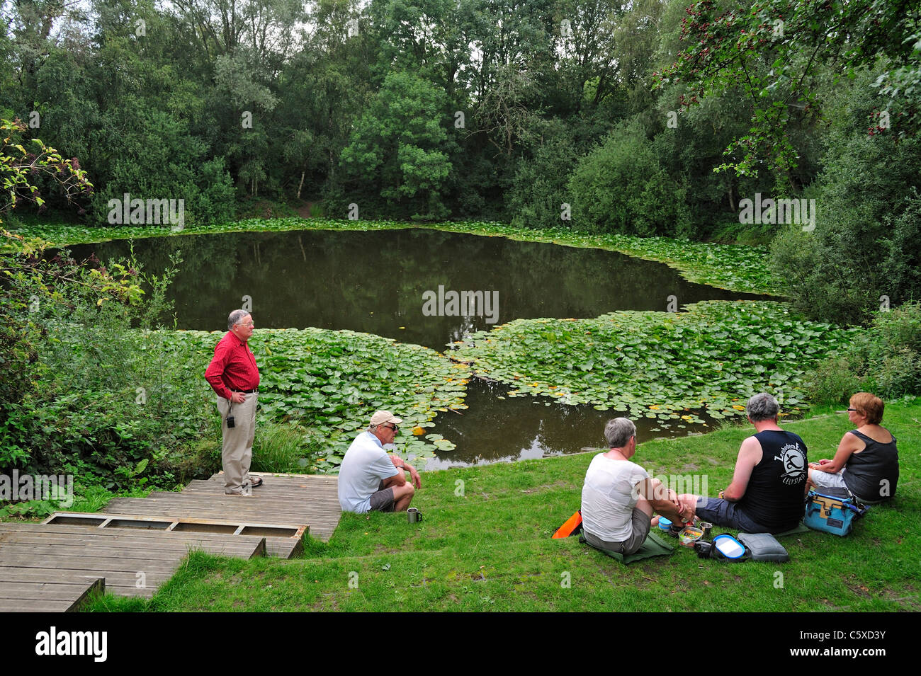 Tourists in front of WW1 mine crater Pool of Peace ...