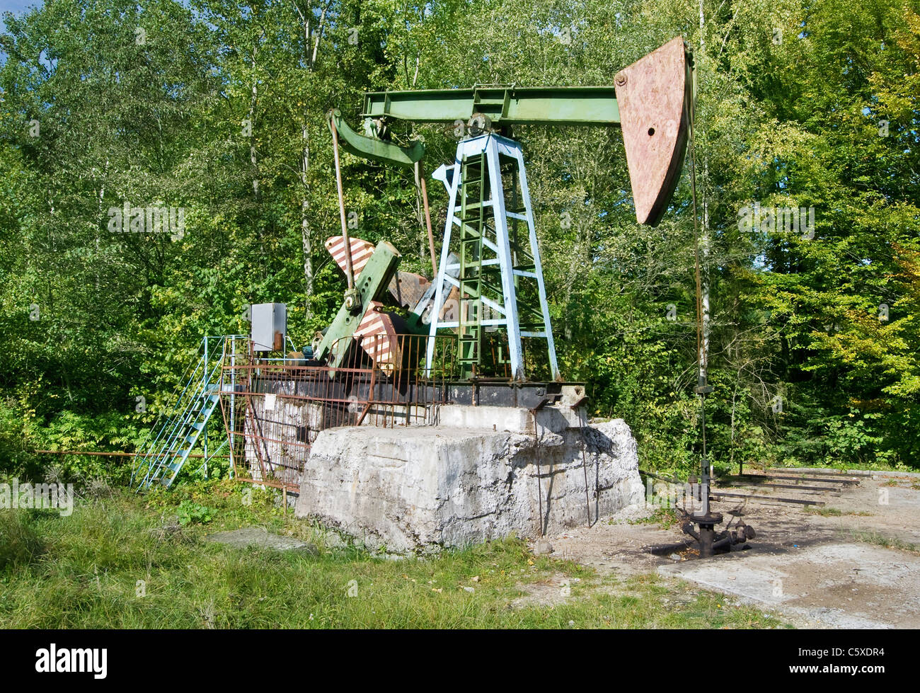 oil pump on a background the forest Stock Photo - Alamy