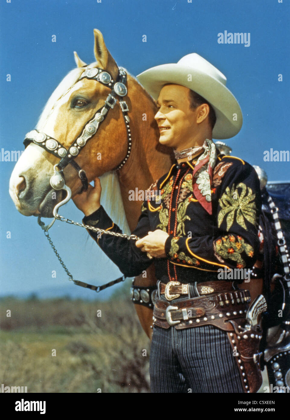 ROY ROGERS (1911-1998) US singer and cowboy film actor with his horse ...