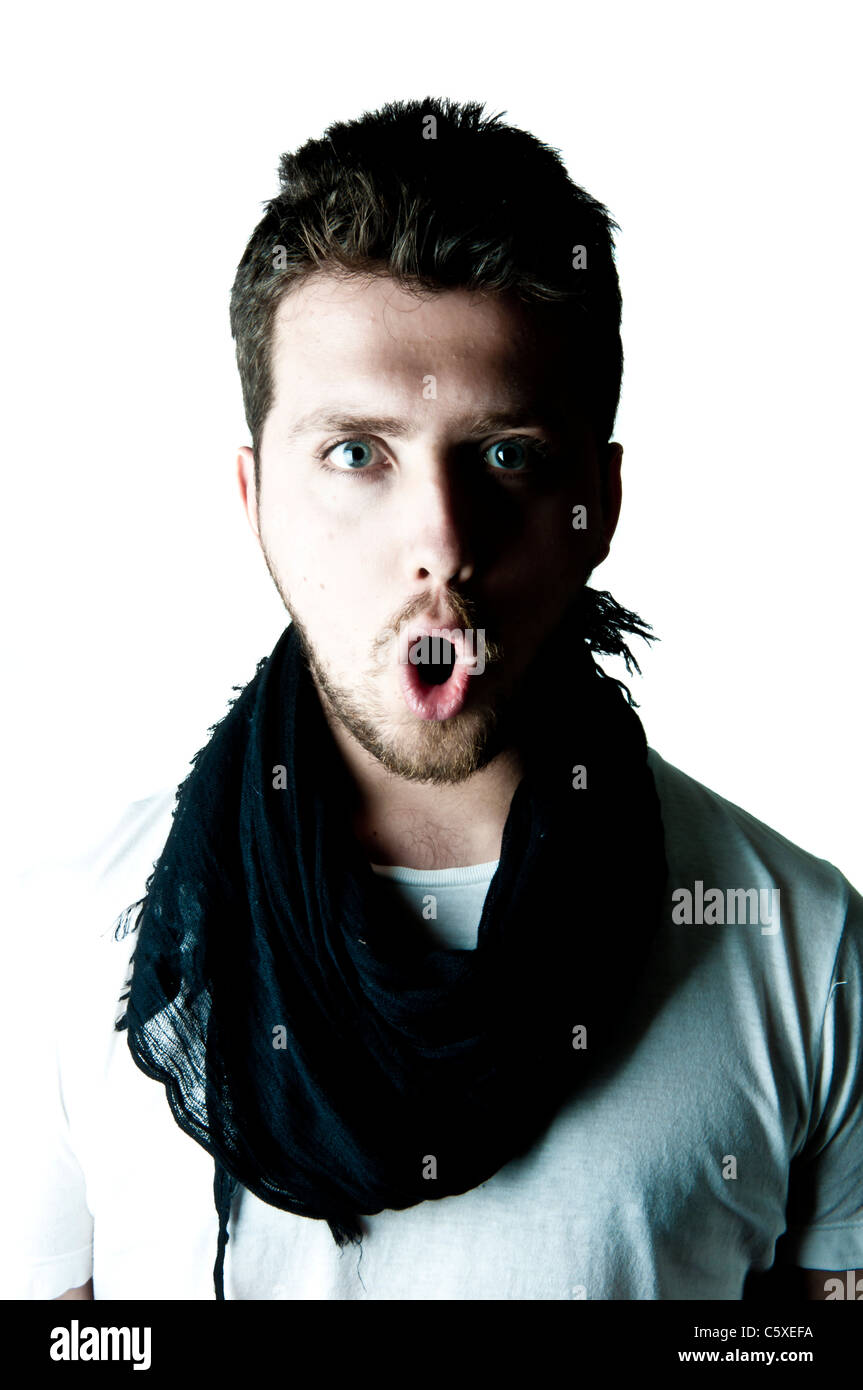 Portrait of amazed young man with blue eyes Stock Photo - Alamy