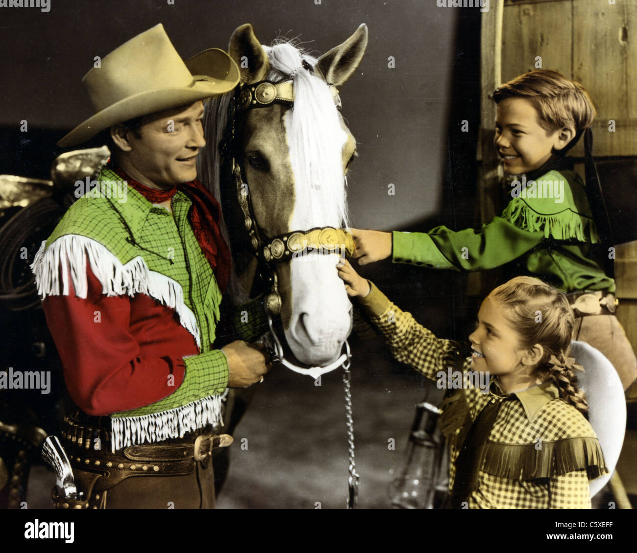 ROY ROGERS (1911-1998) US singer and cowboy film actor with his horse ...