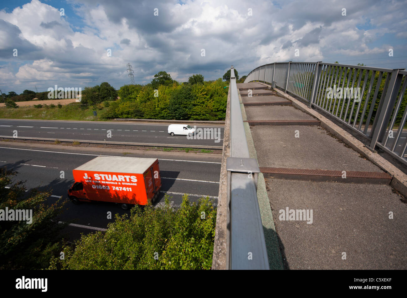 Footbridge over dual carriageway Stock Photo - Alamy