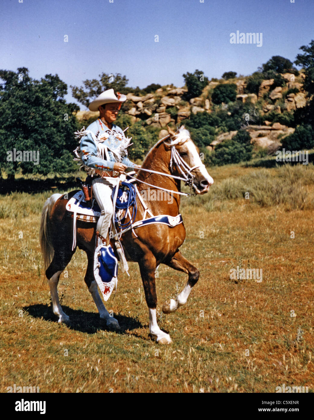 ROY ROGERS (1911-1998) US singer and cowboy film actor with his horse ...
