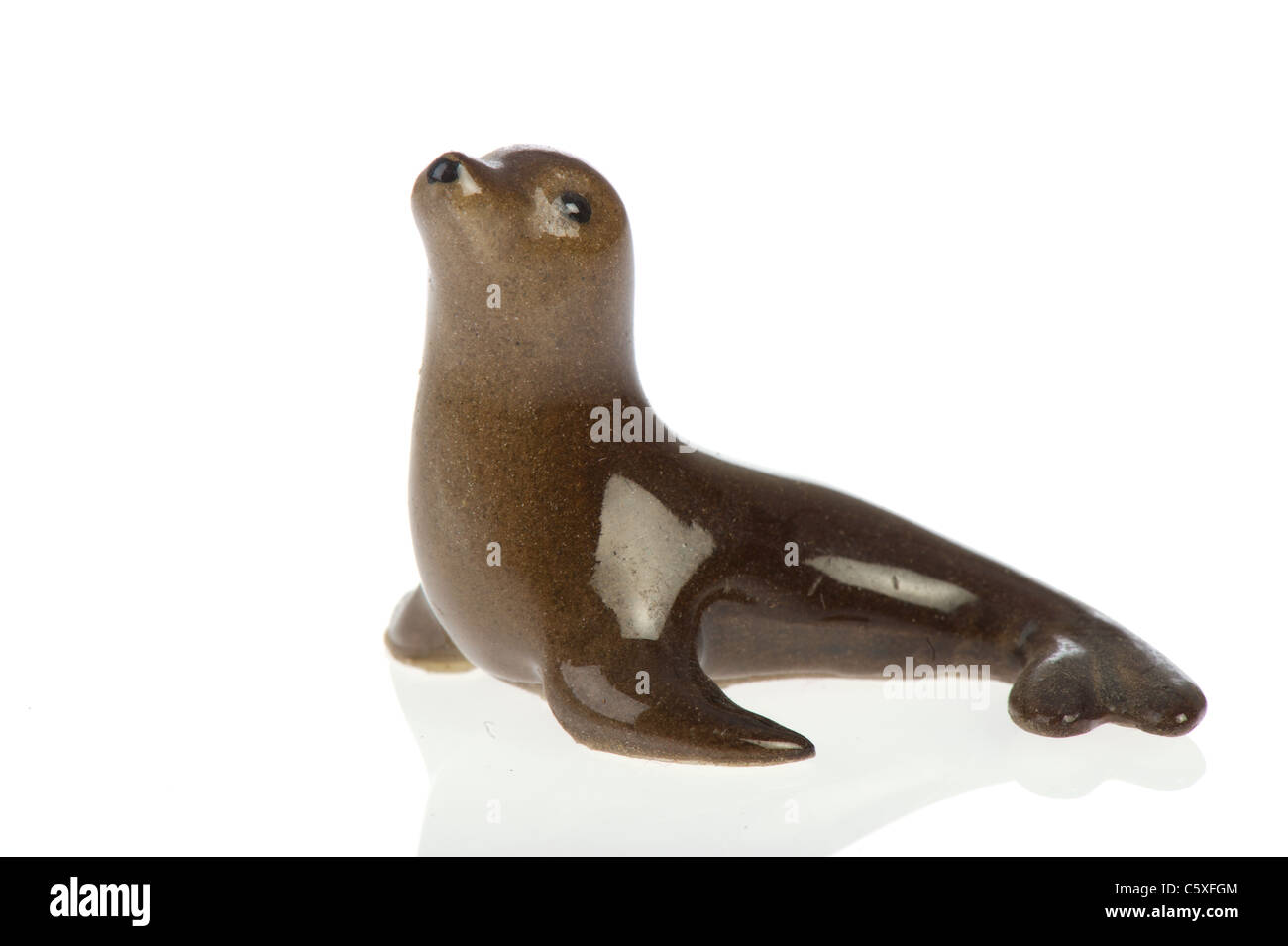 Miniature seal from stone isolated over white background Stock Photo ...