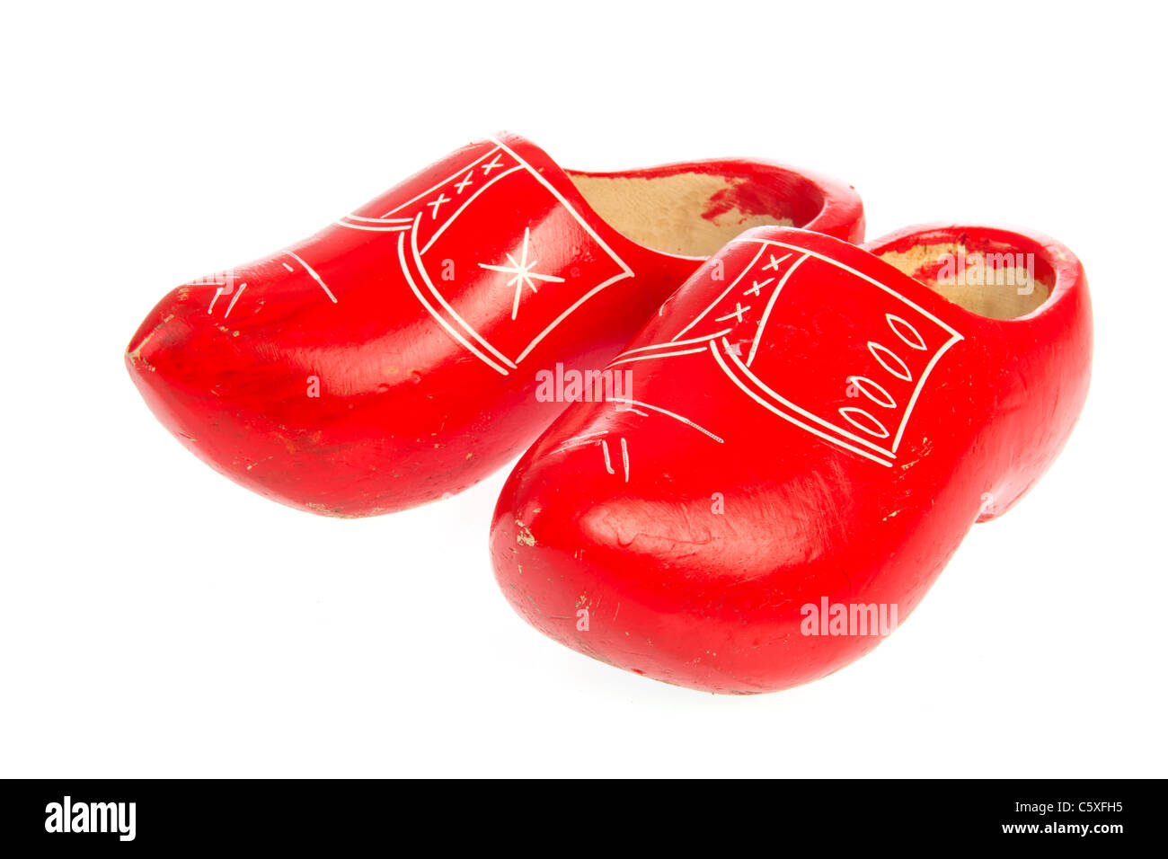 Pair of Dutch red wooden clogs isolated over white Stock Photo - Alamy