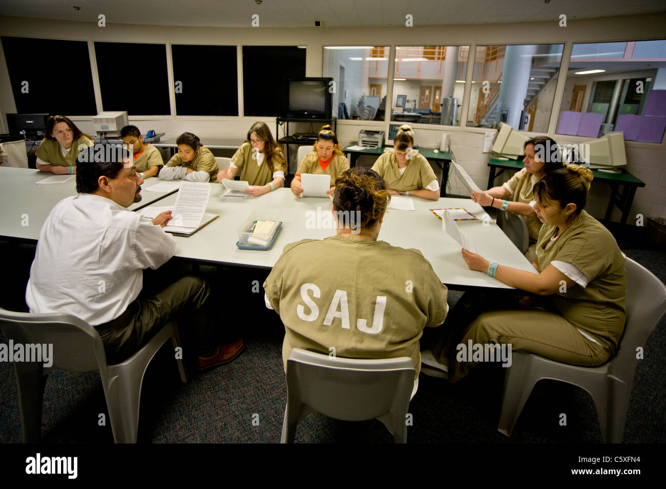 Women in jail group talking hi-res stock photography and images - Alamy