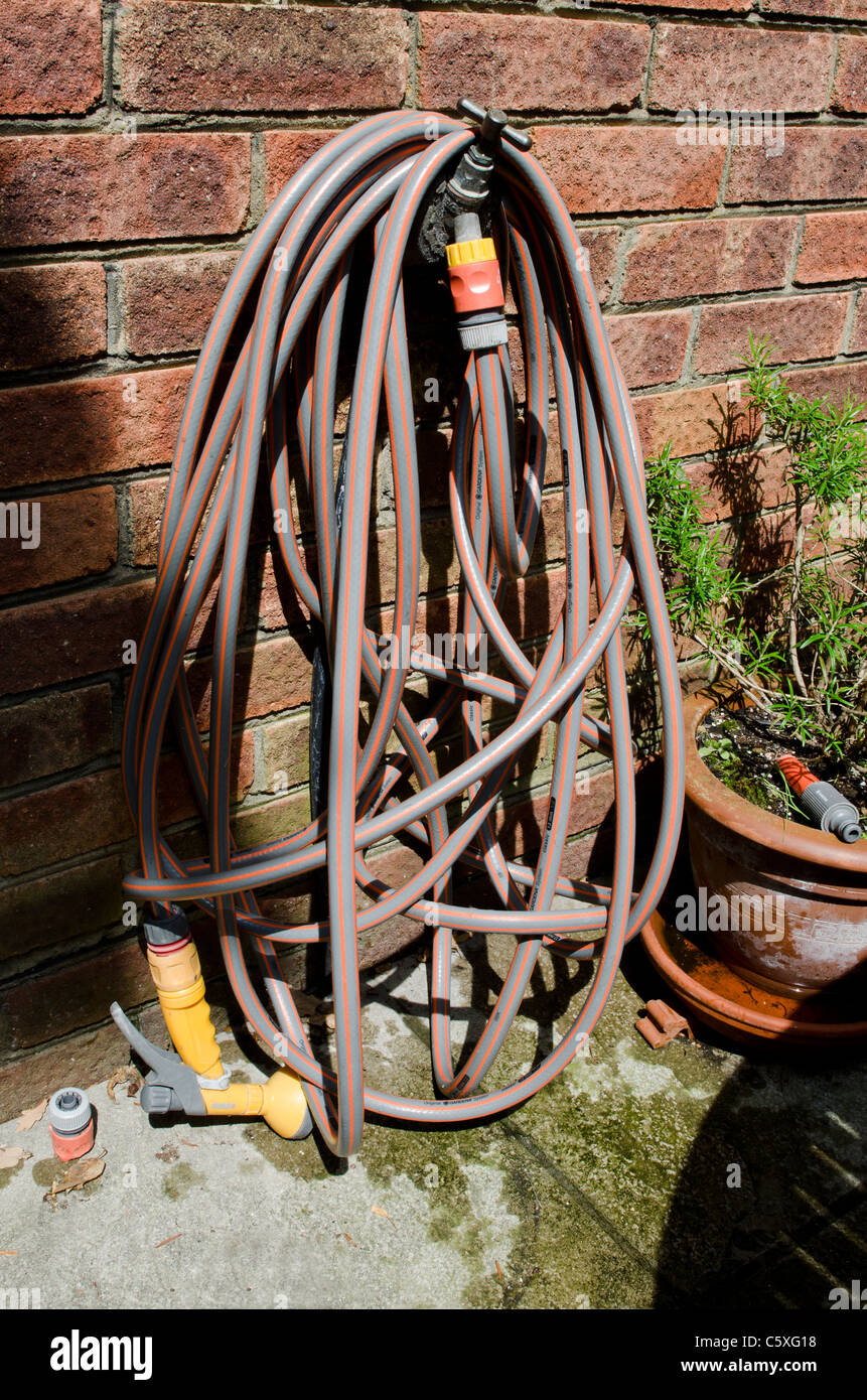 Garden hose and outside tap Stock Photo - Alamy