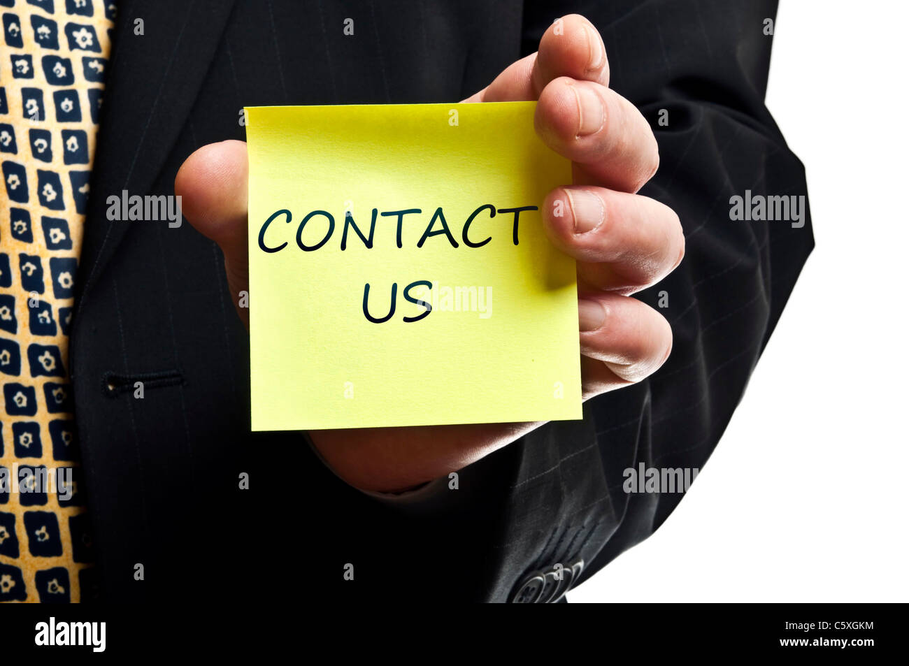 Business man showing "Contact Us" post it Stock Photo - Alamy