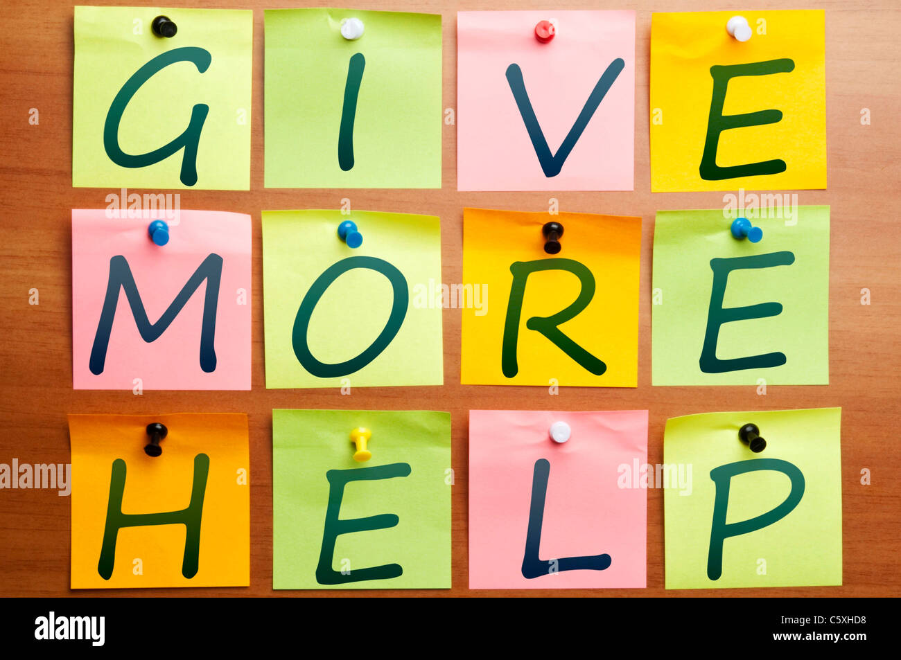Give more help made by post it Stock Photo - Alamy