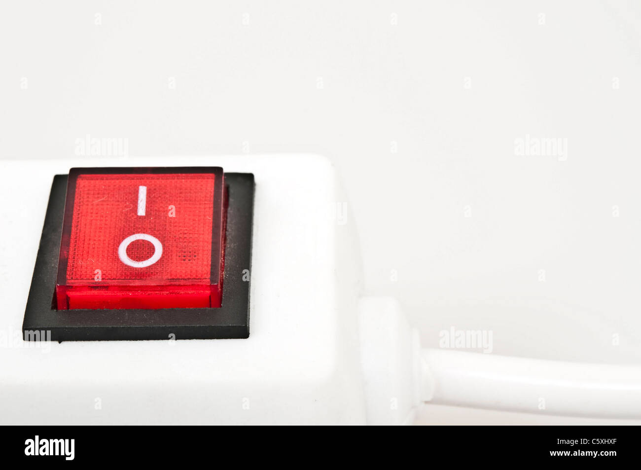 Isolated power outlet with red button Stock Photo - Alamy