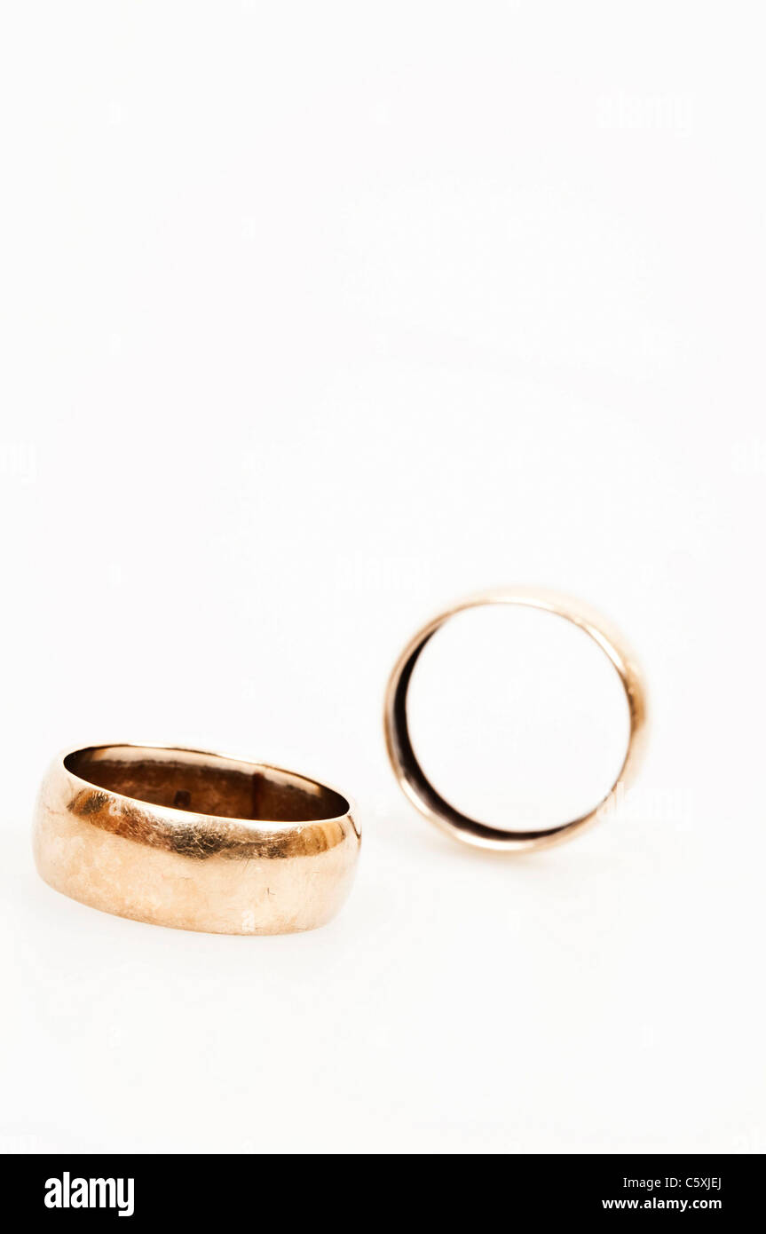 Isolated wedding rings on white background Stock Photo - Alamy