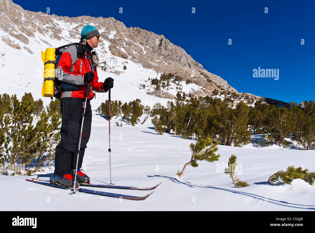 Backcountry skier climbing Piute Pass, Inyo National Forest, Sierra ...