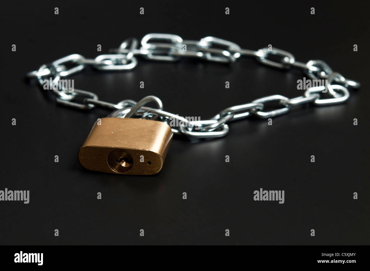 Chain and padlock on black Stock Photo - Alamy