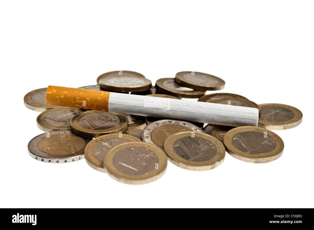 Cigarette on money on white background Stock Photo - Alamy