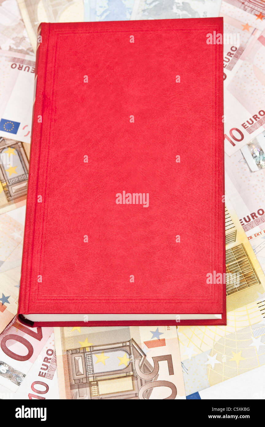 Red book and euro banknotes Stock Photo - Alamy