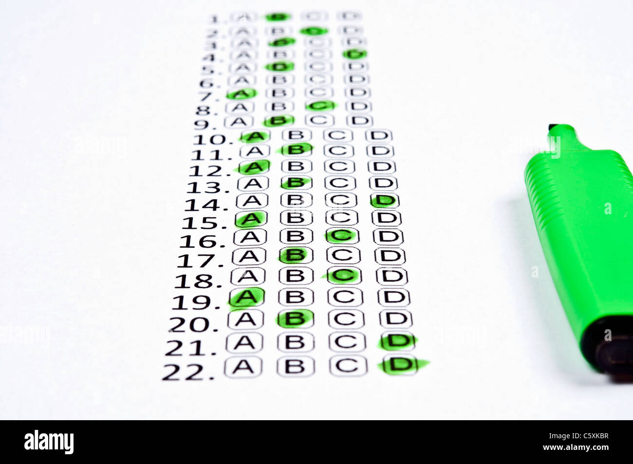 Answer sheet and green marker Stock Photo - Alamy