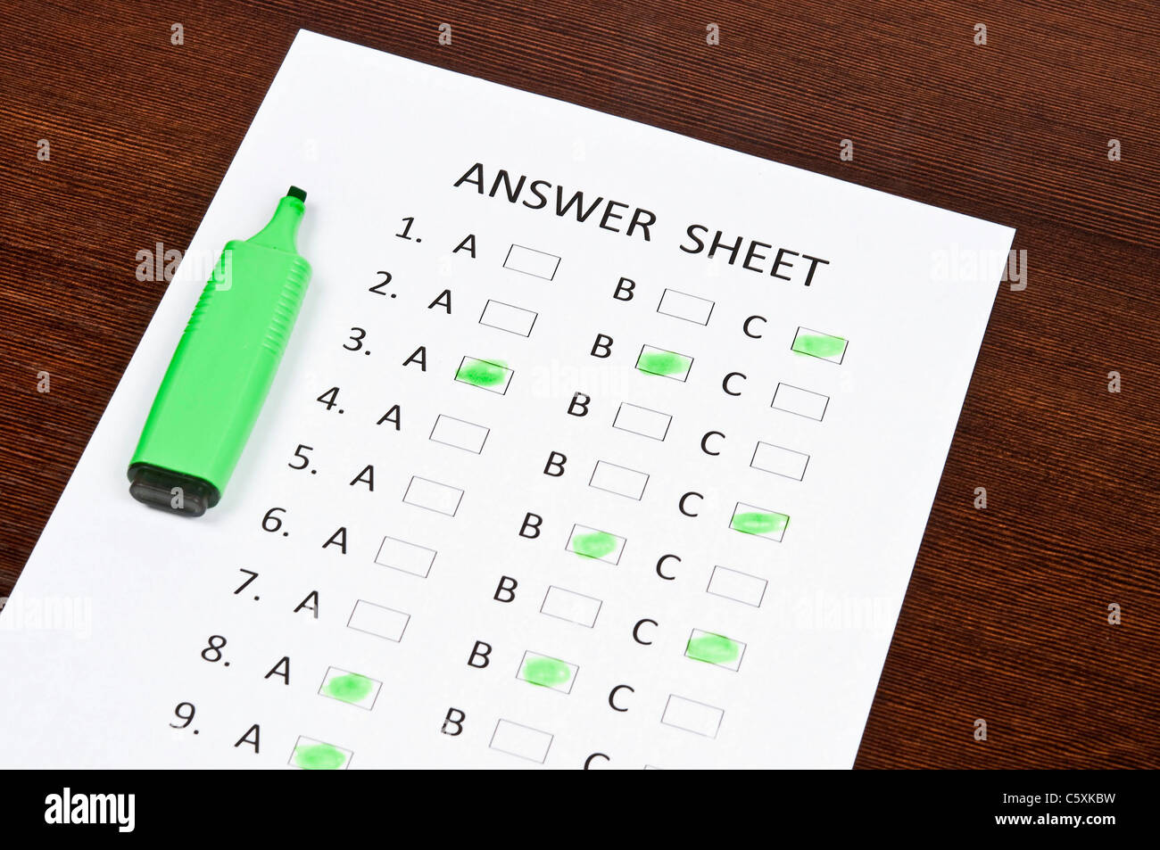 Answer sheet and green marker Stock Photo - Alamy