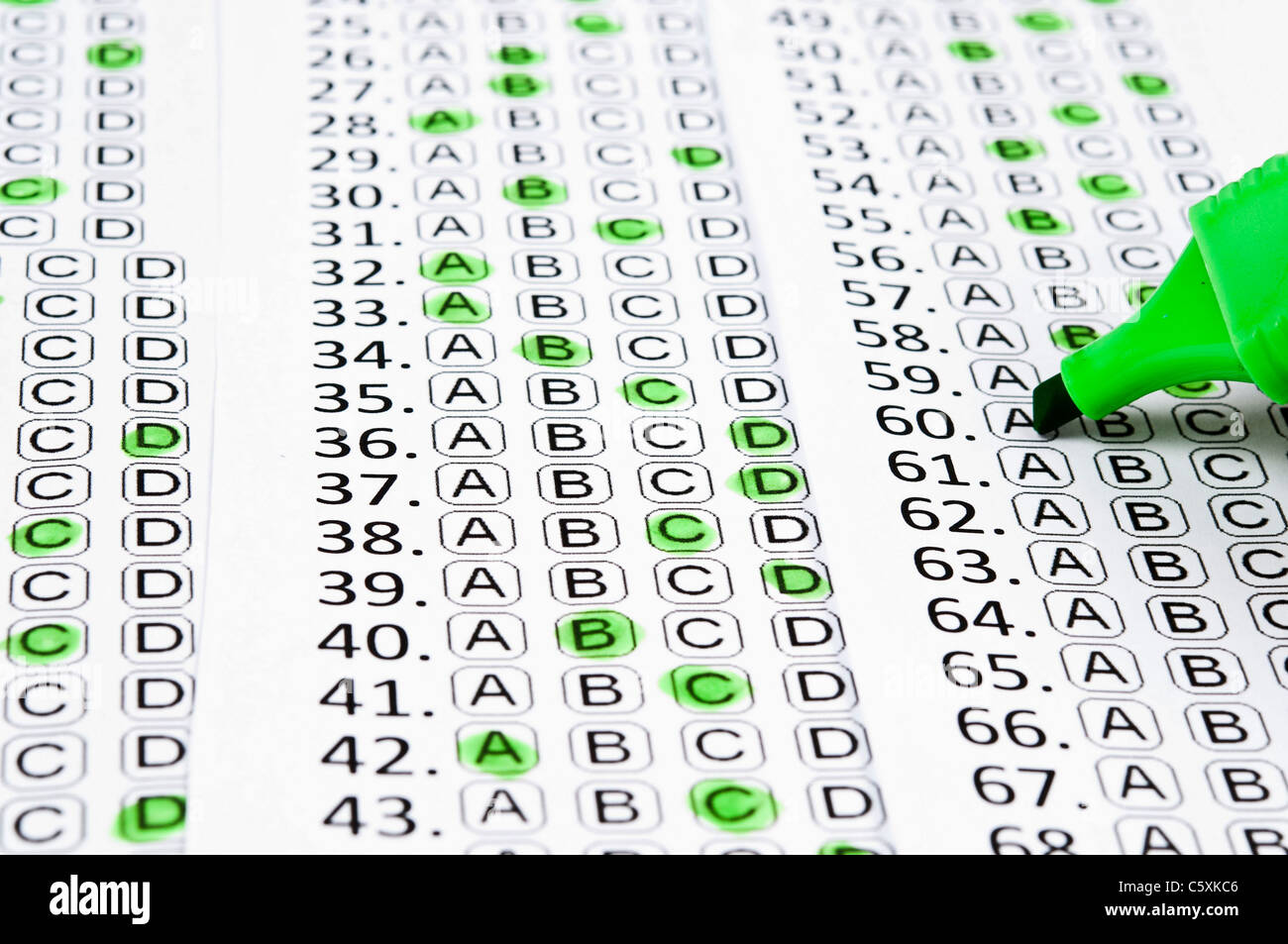 Answer sheet and green marker Stock Photo - Alamy