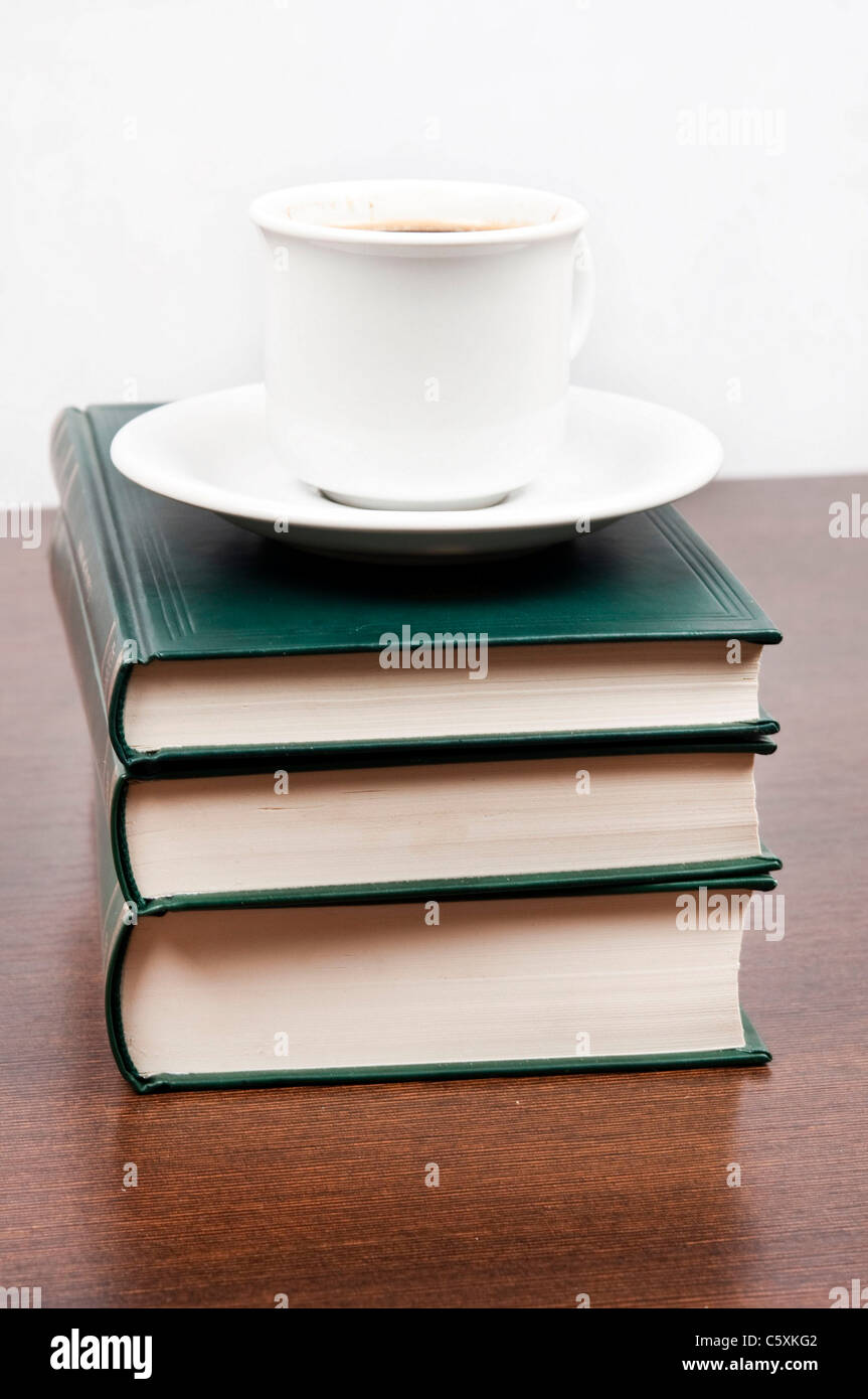 Books and coffe on desk Stock Photo - Alamy