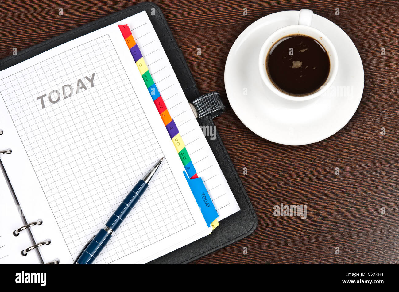 Closeup to agenda and coffee Stock Photo - Alamy